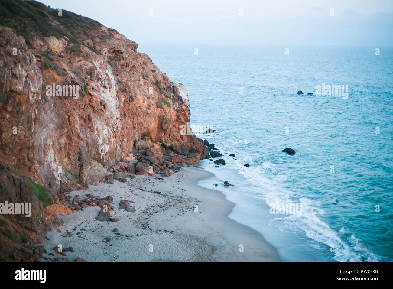 The ocean meets mountain cliff in southern California Stock Photo - Alamy