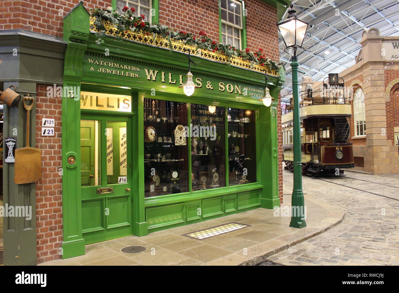 Green Vintage shop front Wills @ Sons Stock Photo - Alamy