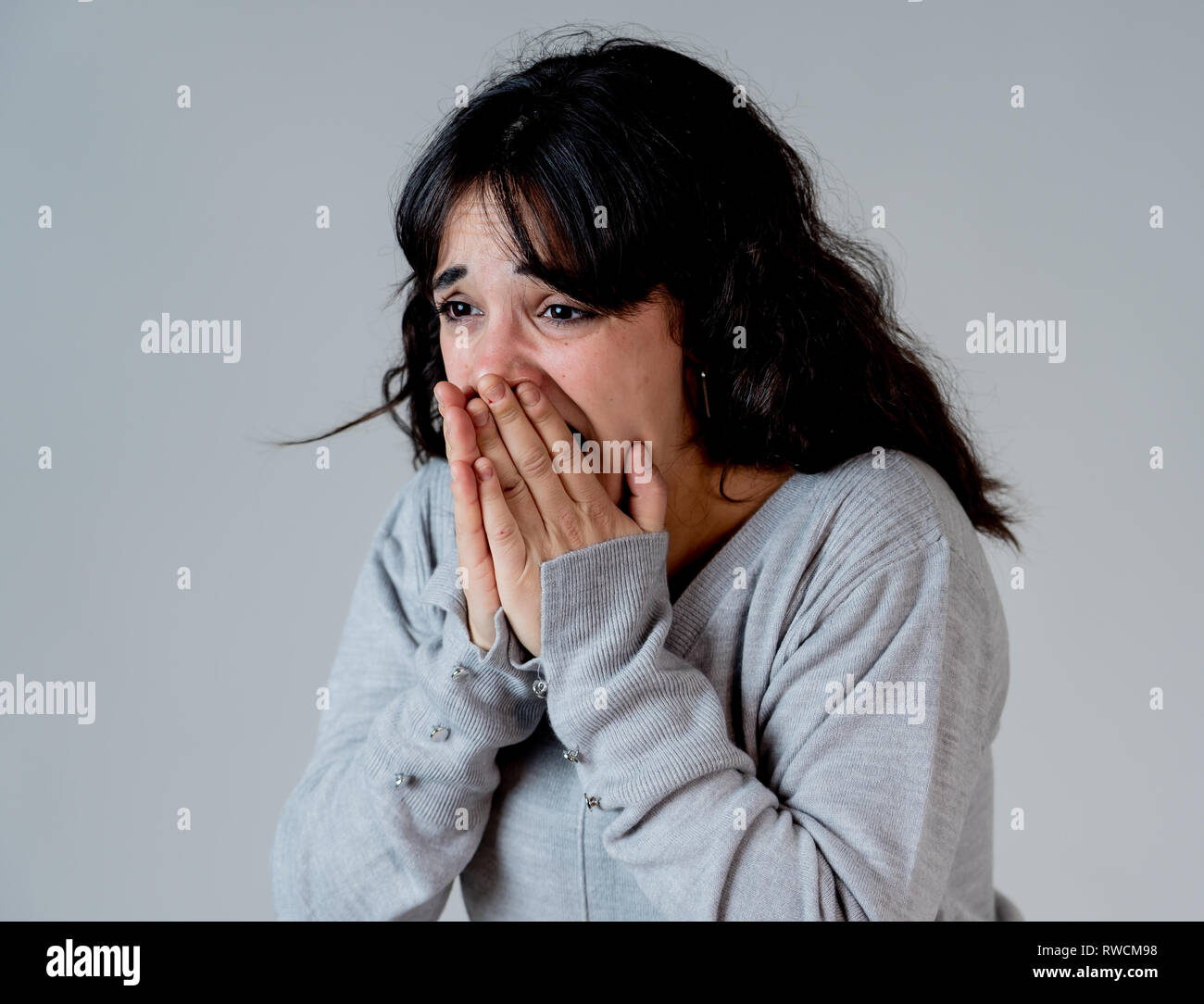 Close up portrait of scared and shocked young woman receiving bad news ...