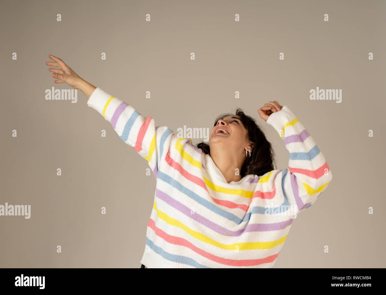 Portrait of shocked young woman wining the lottery or having great ...