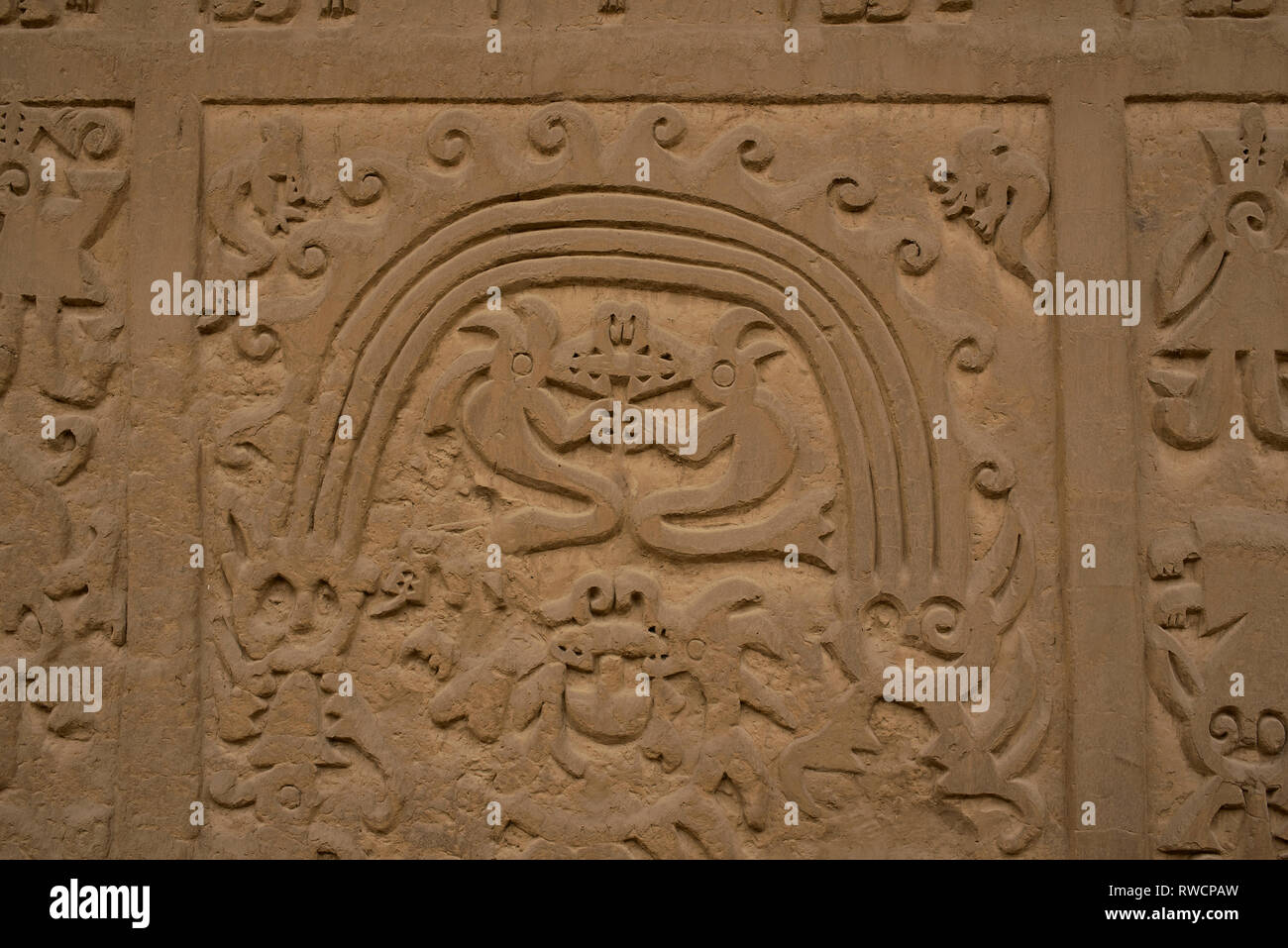 Relief of zoomorphic figures on adobe wall. Chan Chan, ancient capital ...