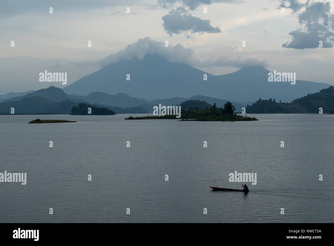 Lake Mutanda with views of volcanoes of the Virunga Mountains, Uganda ...