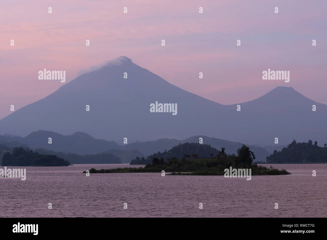 Lake Mutanda with views of volcanoes of the Virunga Mountains, Uganda ...