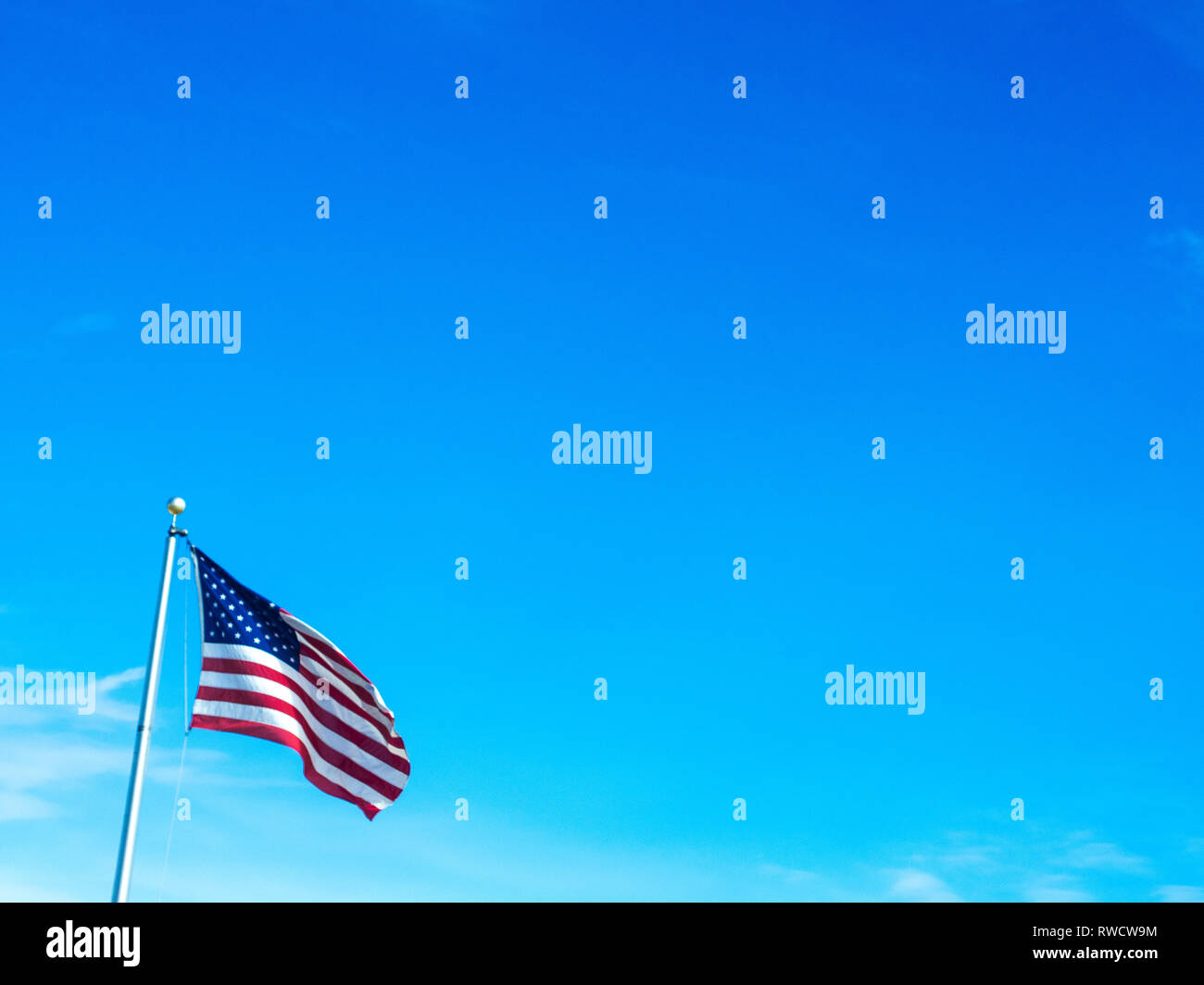 American flag on blue sky Stock Photo - Alamy
