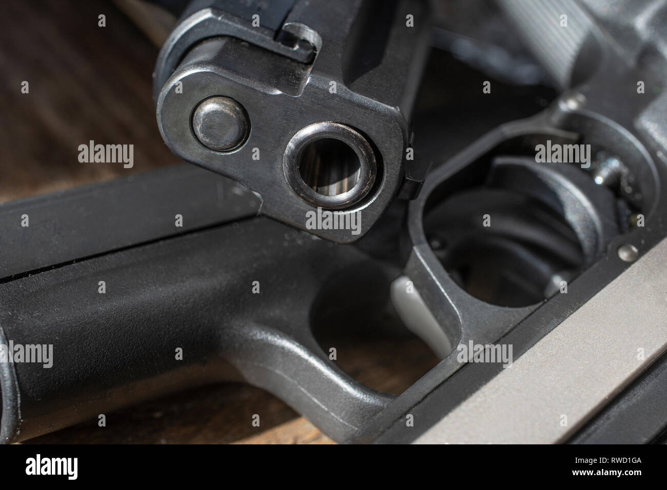 pistol laying on a table Stock Photo - Alamy