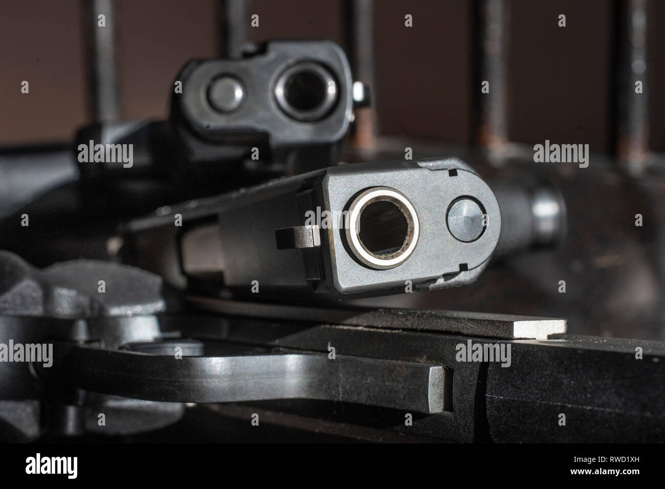 pistol laying on a table Stock Photo - Alamy