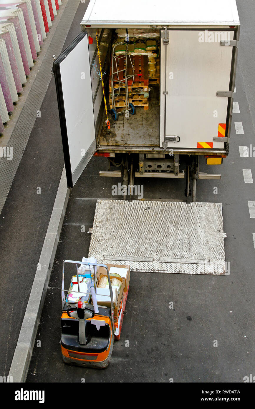 Commercial Goods Delivery Truck and Forklift Vehicle Stock Photo - Alamy