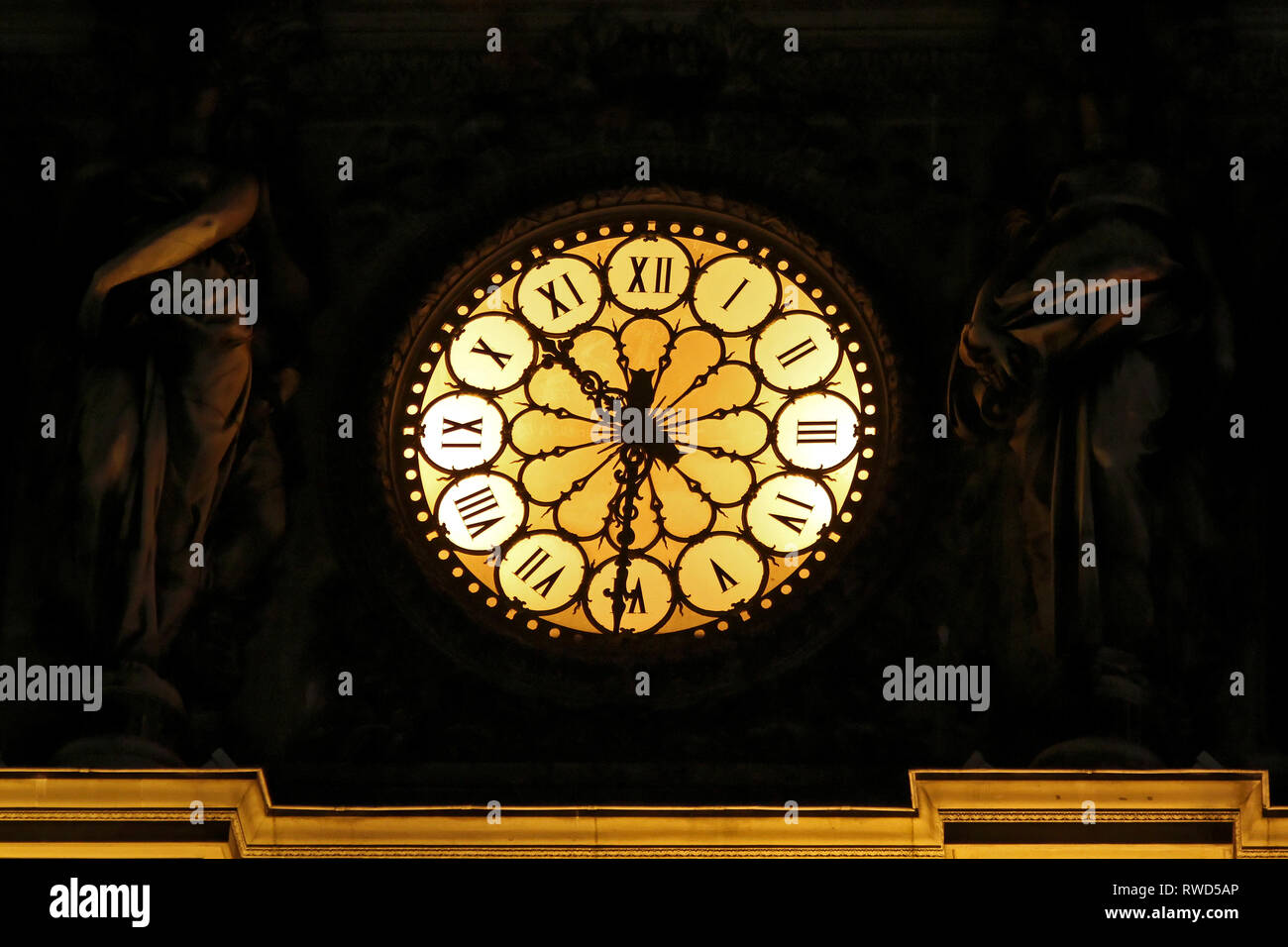 Medieval Analog Clock With Illumination at Night Stock Photo - Alamy