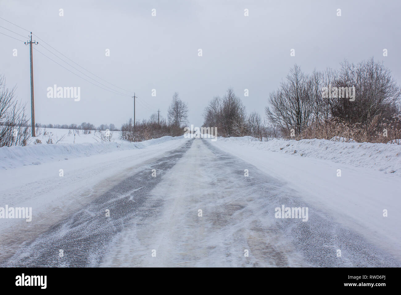 Snowy winter road. The road is covered up. Russian dear. Winter fairy ...