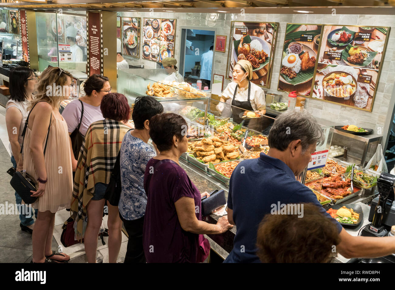 Singapore - January 28, 2019 : - Customers buy prepared meal on a food ...