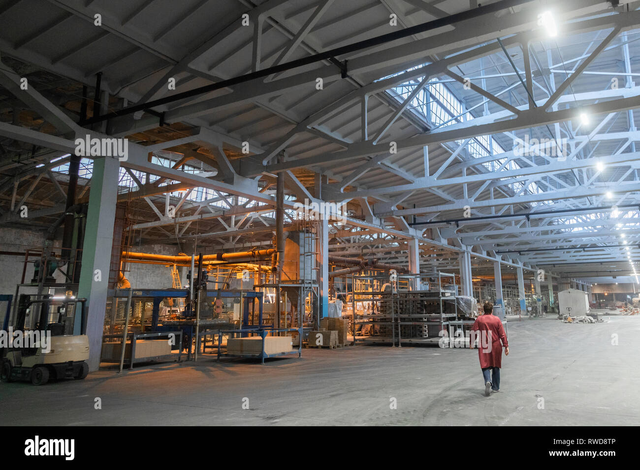 Workers perform their tasks in the shop production plant Stock Photo ...