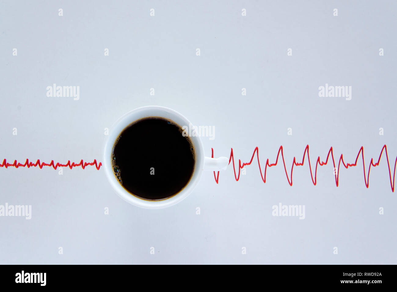 Coffee cup with electrocardiogram lines on white background Stock Photo ...