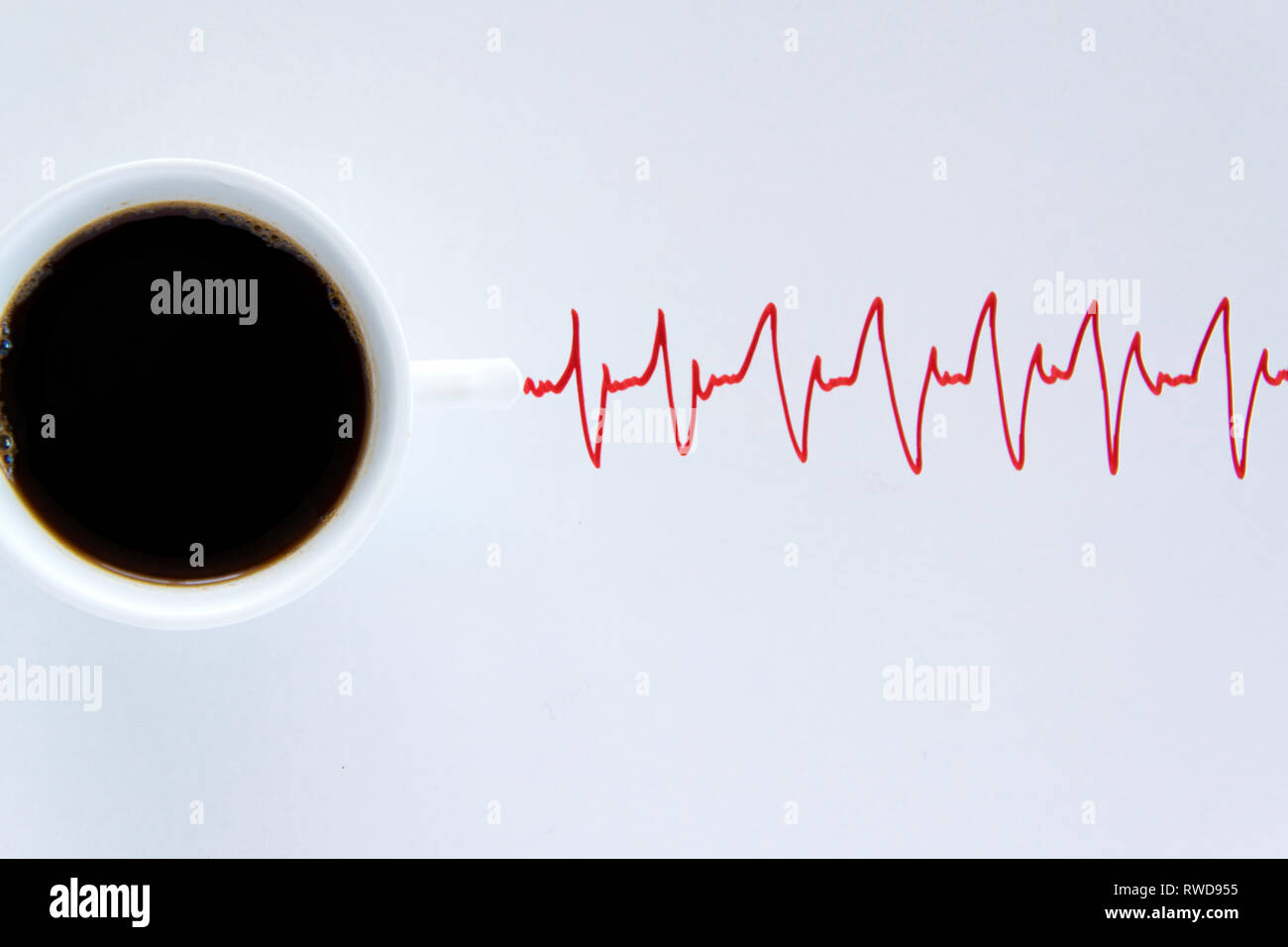Coffee cup with electrocardiogram lines on white background Stock Photo ...