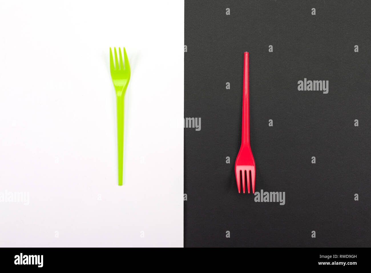 Bright green and red forks isolated on black and white background Stock ...