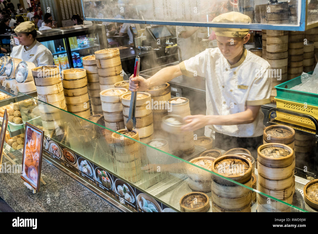 Singapore - January 28, 2019 : - Vendor is preparing steamed dim sums ...