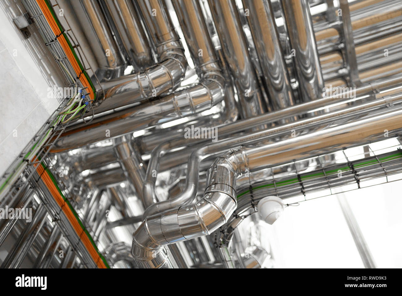 bright wires and chrome pipes. industrial background Stock Photo - Alamy