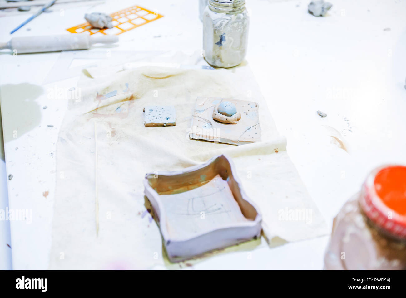 top view on table at clay arts workshop for children in ceramic studio ...