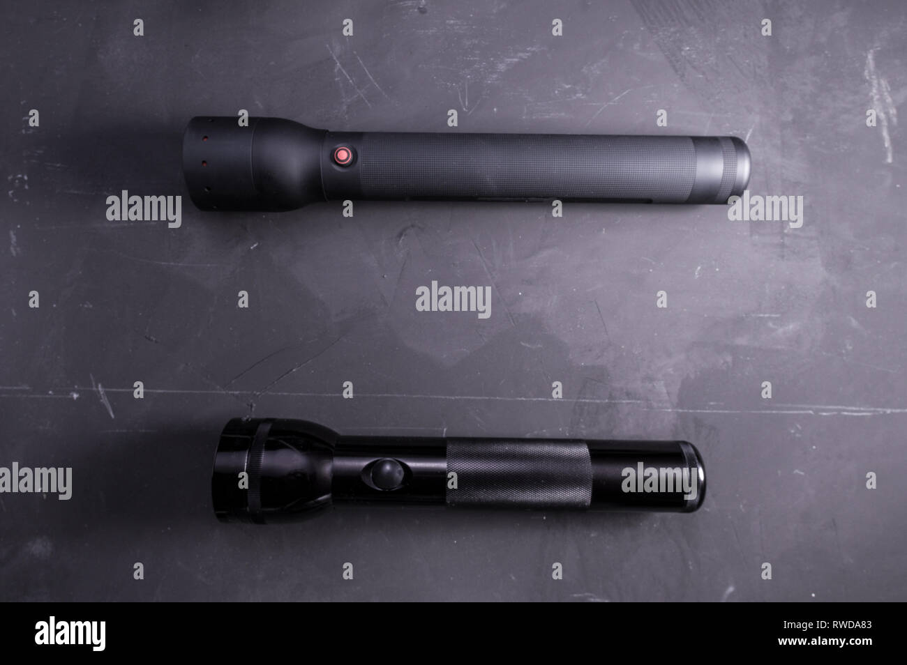 Two large flashlight. Police flashlights. Black lanterns. Top view ...