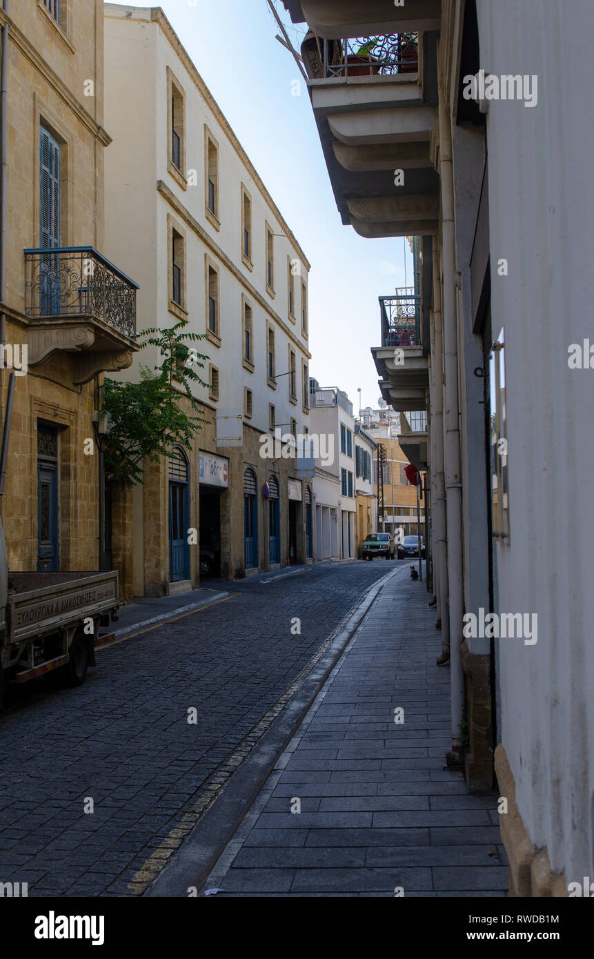 A quiet street in the old town with colorful houses and tiny stalls ...