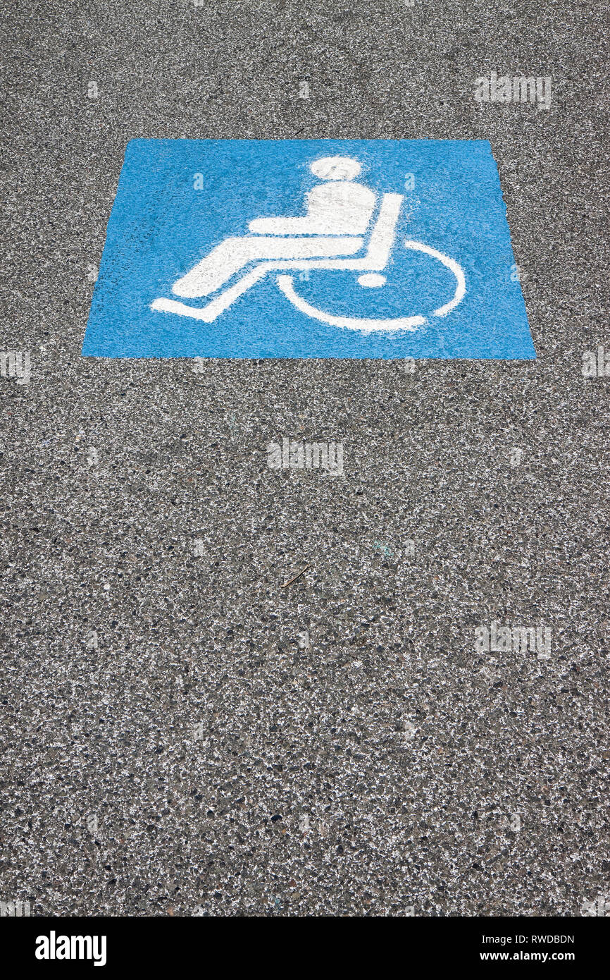 Symbol of the handicapped person painted on the asphalt Stock Photo - Alamy