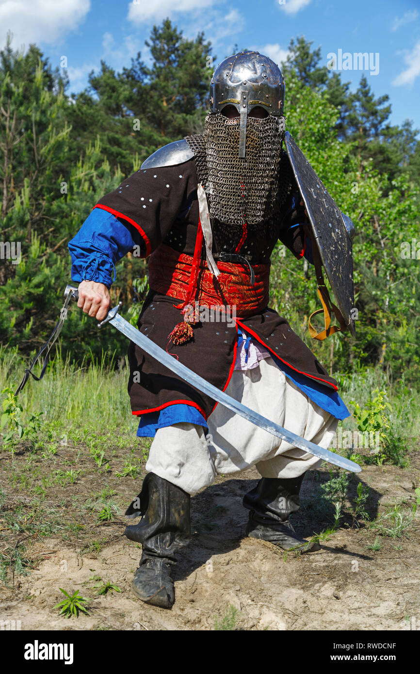 Mongol horde warrior in armour, holding traditional saber Stock Photo ...