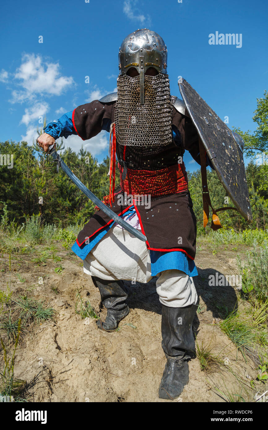 Mongol horde warrior in armour, holding traditional saber Stock Photo ...