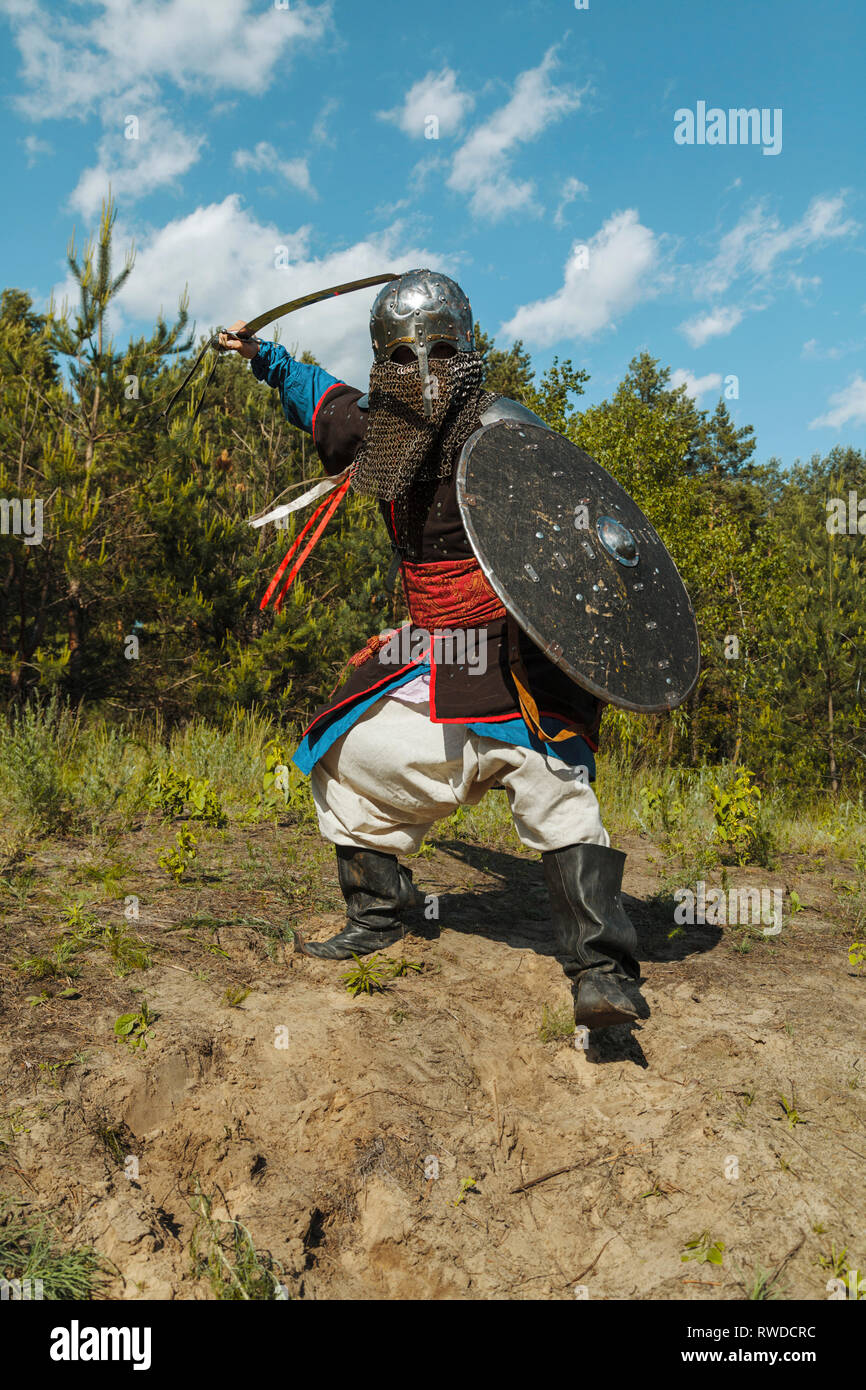 Mongol horde warrior in armour, holding traditional saber Stock Photo ...
