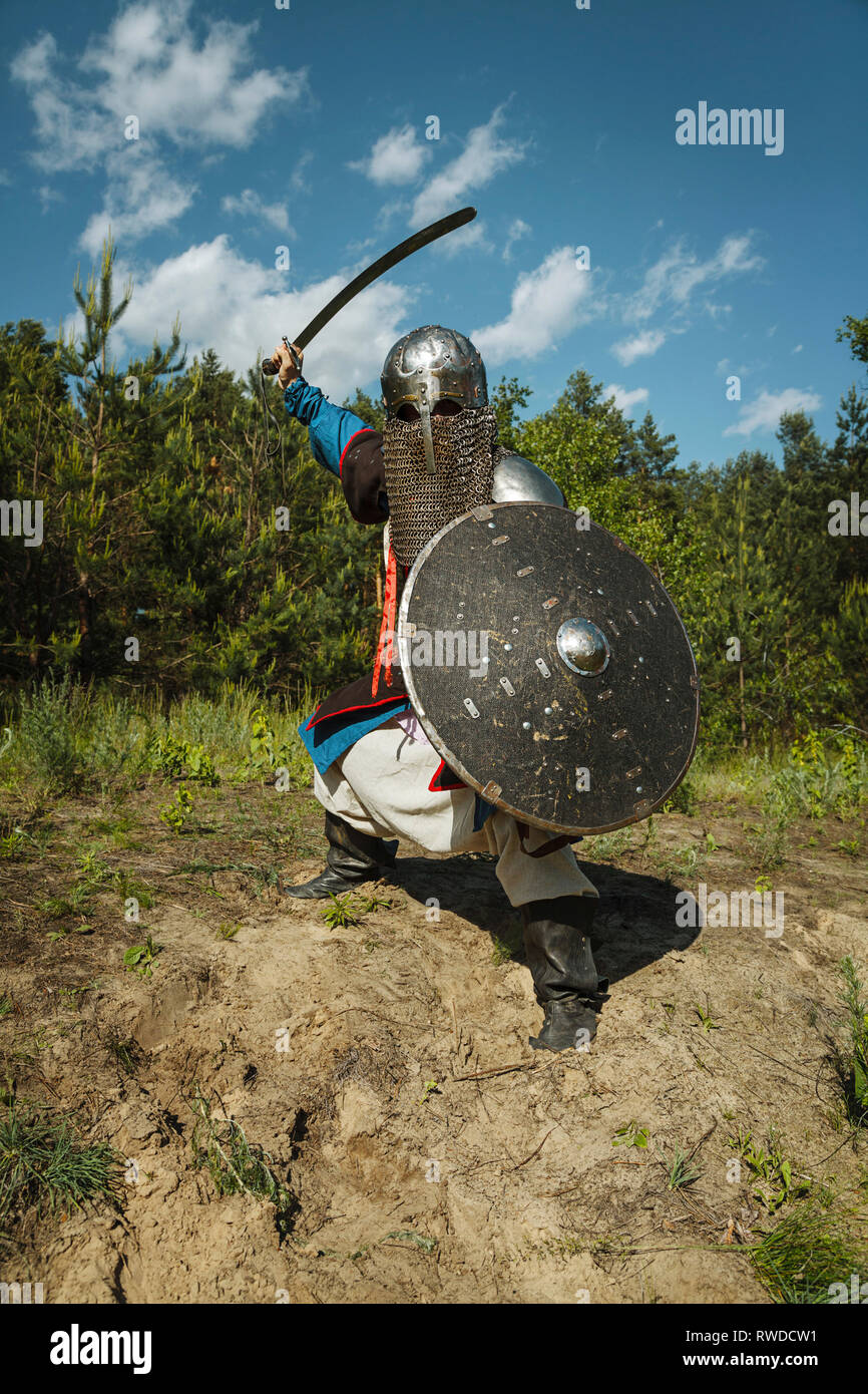 Mongol horde warrior in armour, holding traditional saber Stock Photo ...