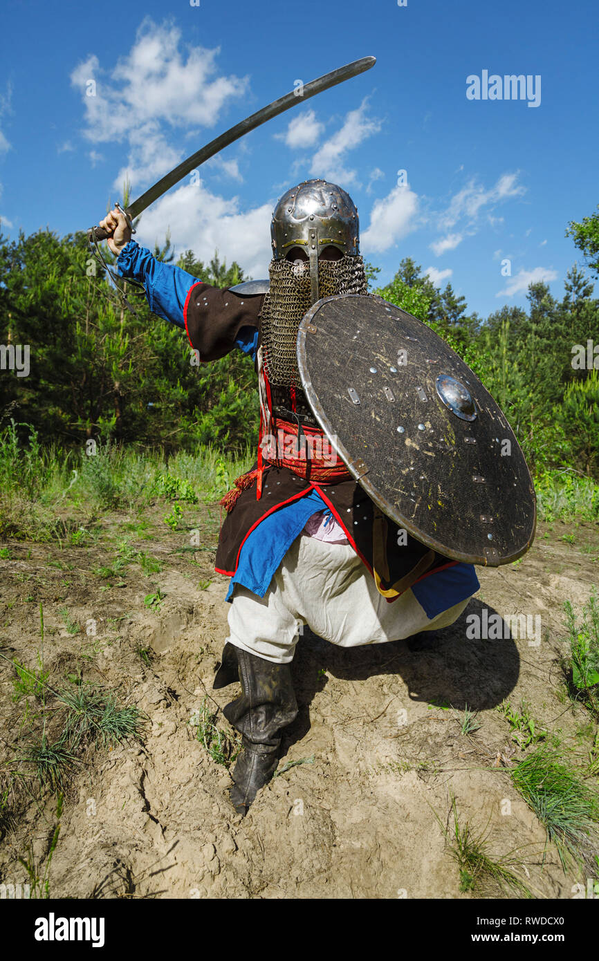 Mongol horde warrior in armour, holding traditional saber Stock Photo ...