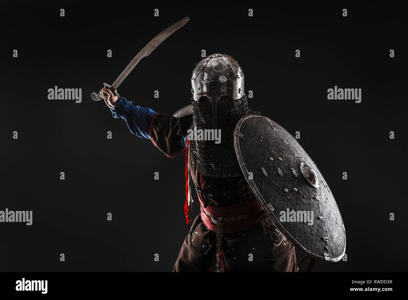 Mongol horde warrior in armour, holding traditional saber Stock Photo ...