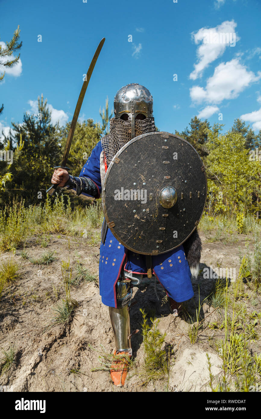 Mongol horde warrior in armour, holding traditional saber Stock Photo ...