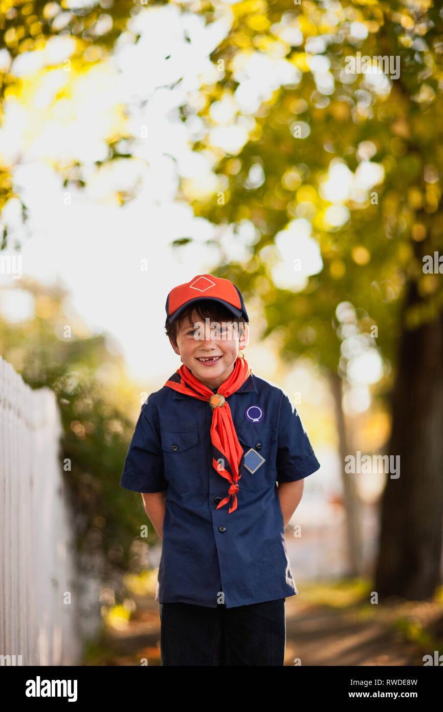 Boy Scout standing on a suburban street Stock Photo - Alamy