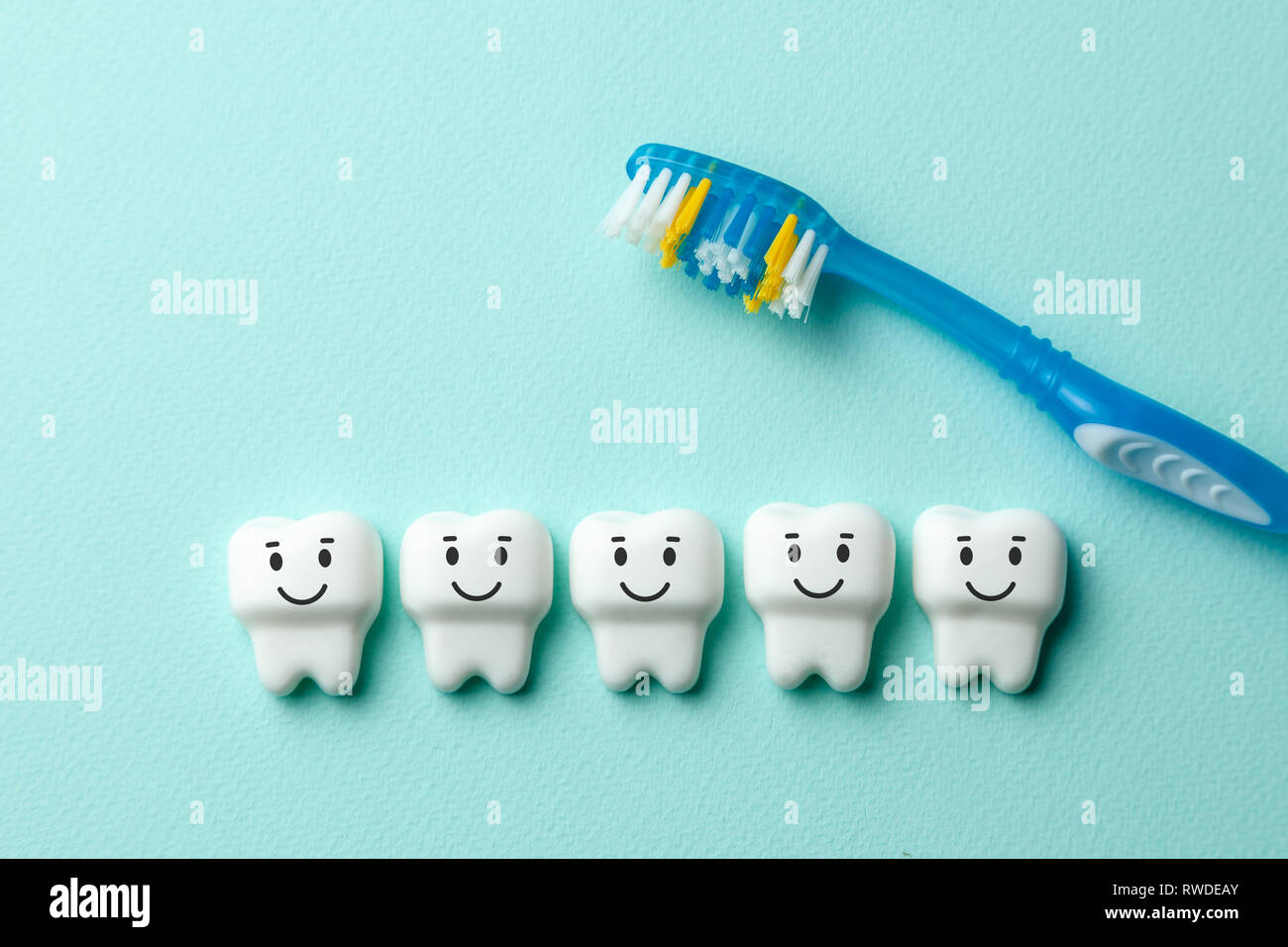 Healthy white teeth are smiling on mint green background with ...