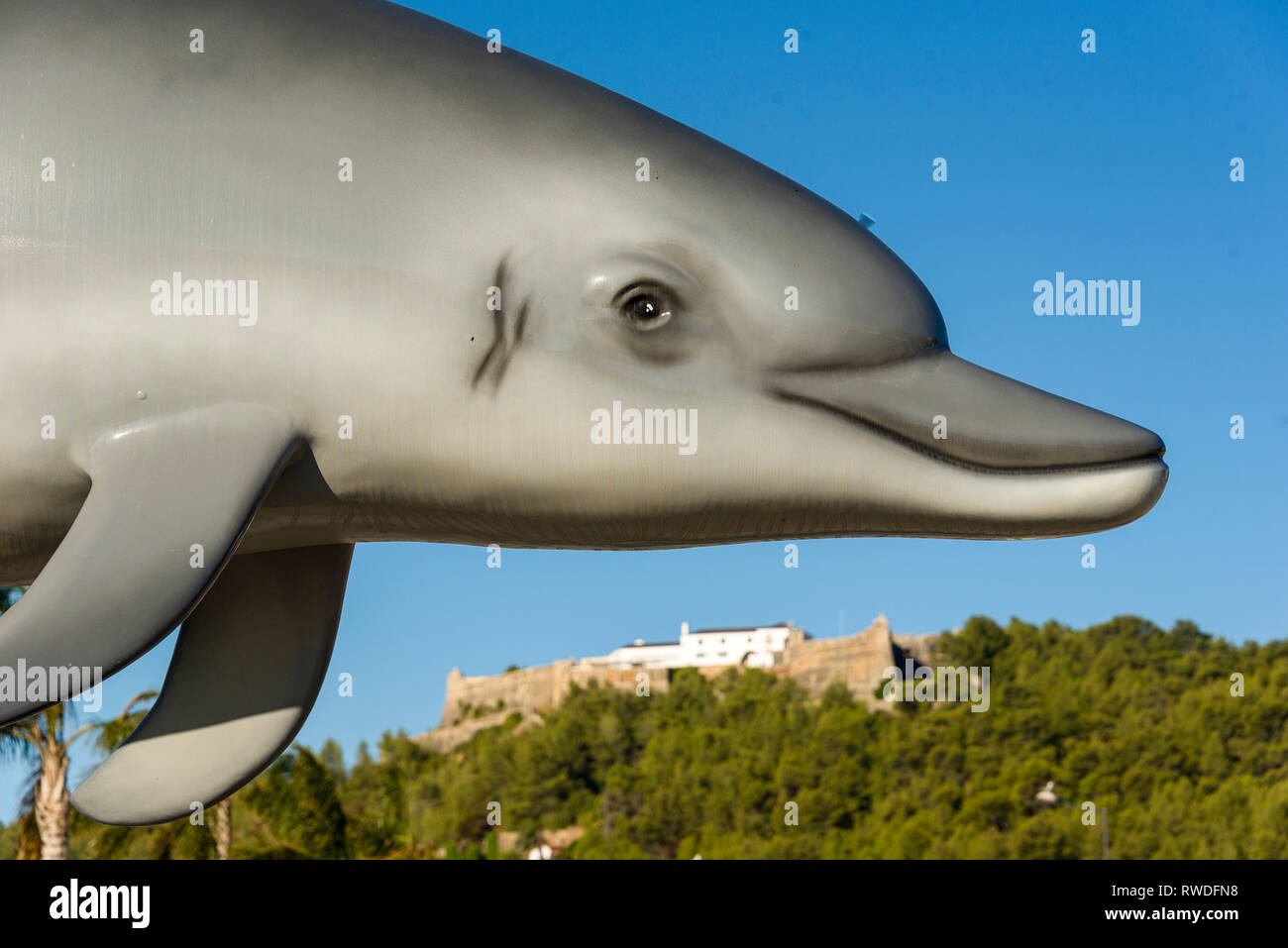 On a wharf "Golfinho Parade" consisting of dolphin replicas with ...
