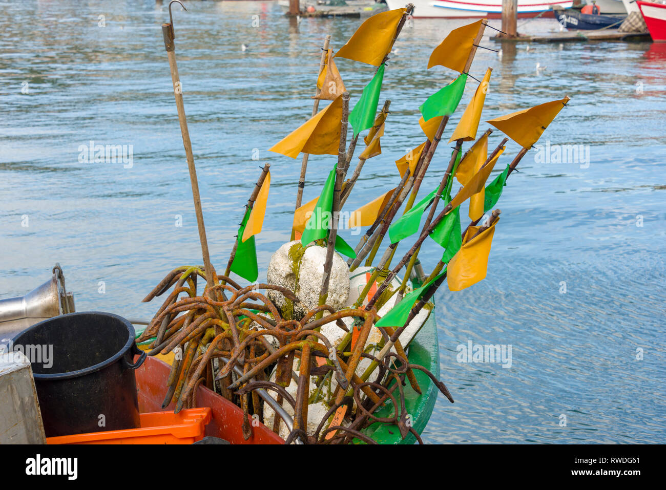 buoy, pennant and anchor on the bow of a fishing boat in Setubal ...