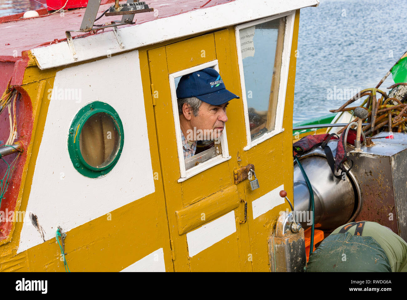 captain of a fishing boat on the port of Setubal, Portugal Stock Photo ...