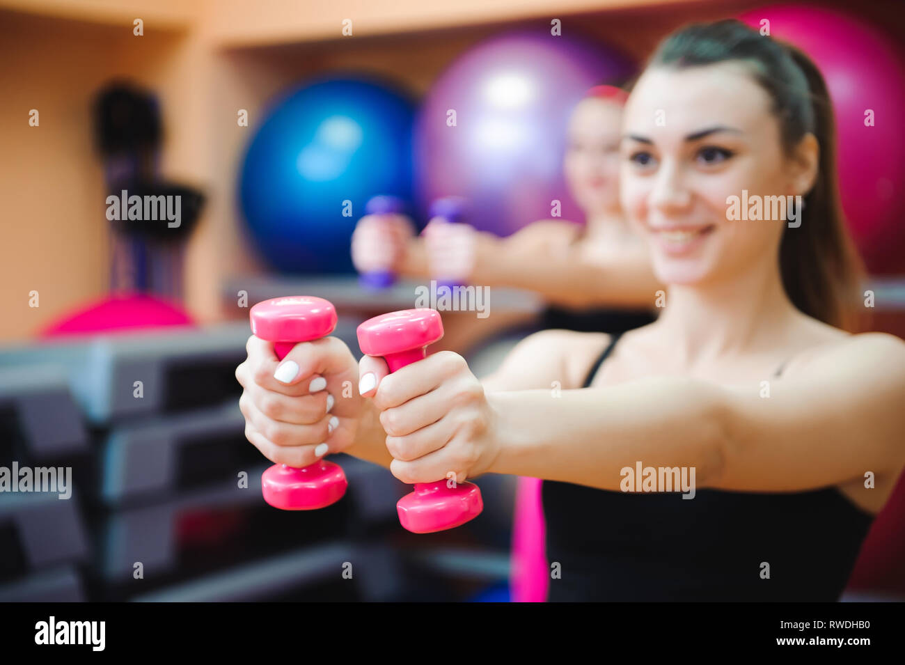 Women flexing muscles in gym hi-res stock photography and images - Alamy