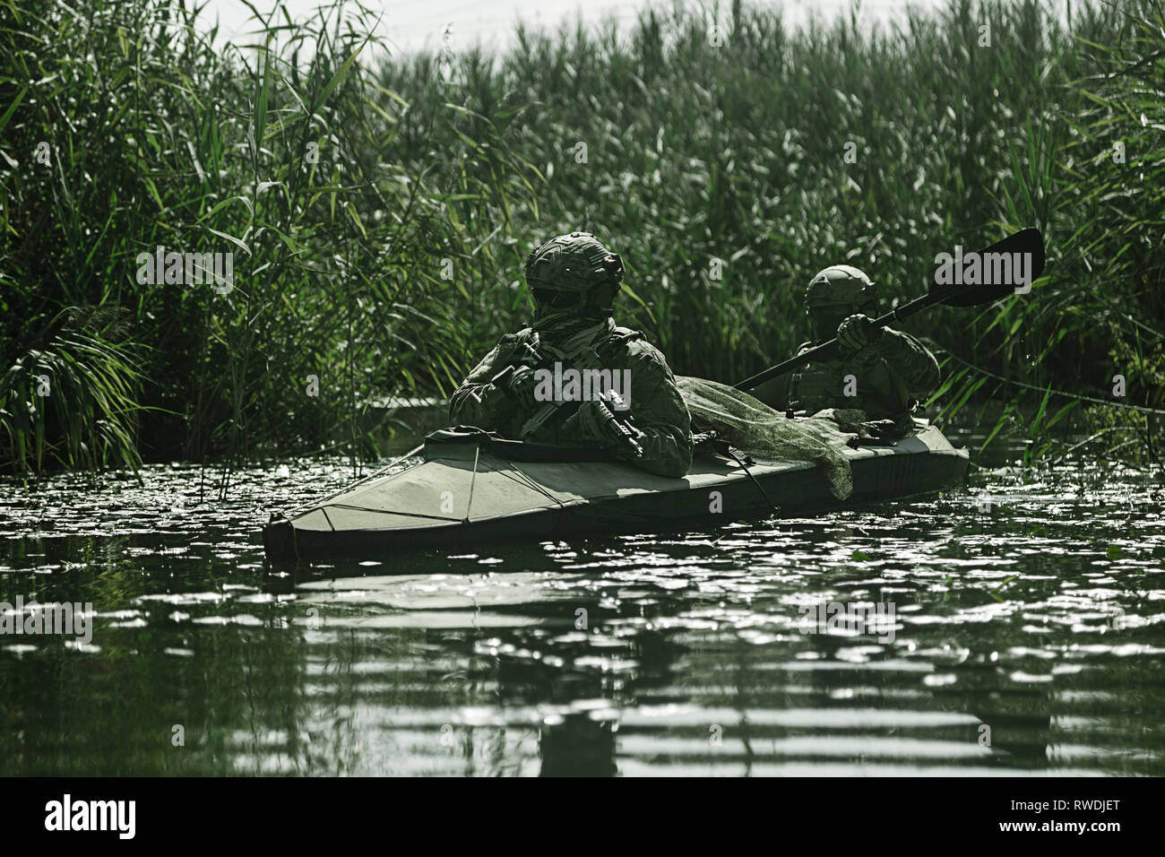 Spec ops in the military kayak Stock Photo - Alamy