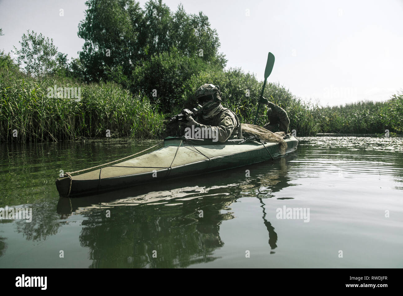 Spec ops in the military kayak Stock Photo - Alamy