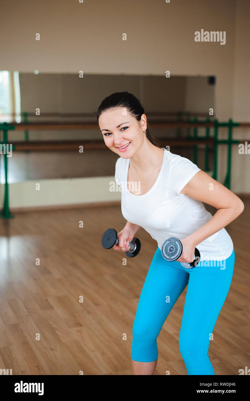 Fitness model doing bodybuilding workout with weights Stock Photo - Alamy