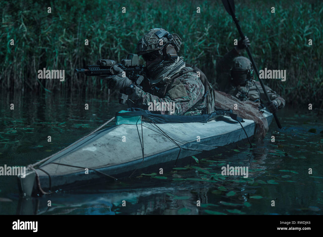 Special forces operators in a military kayak Stock Photo - Alamy