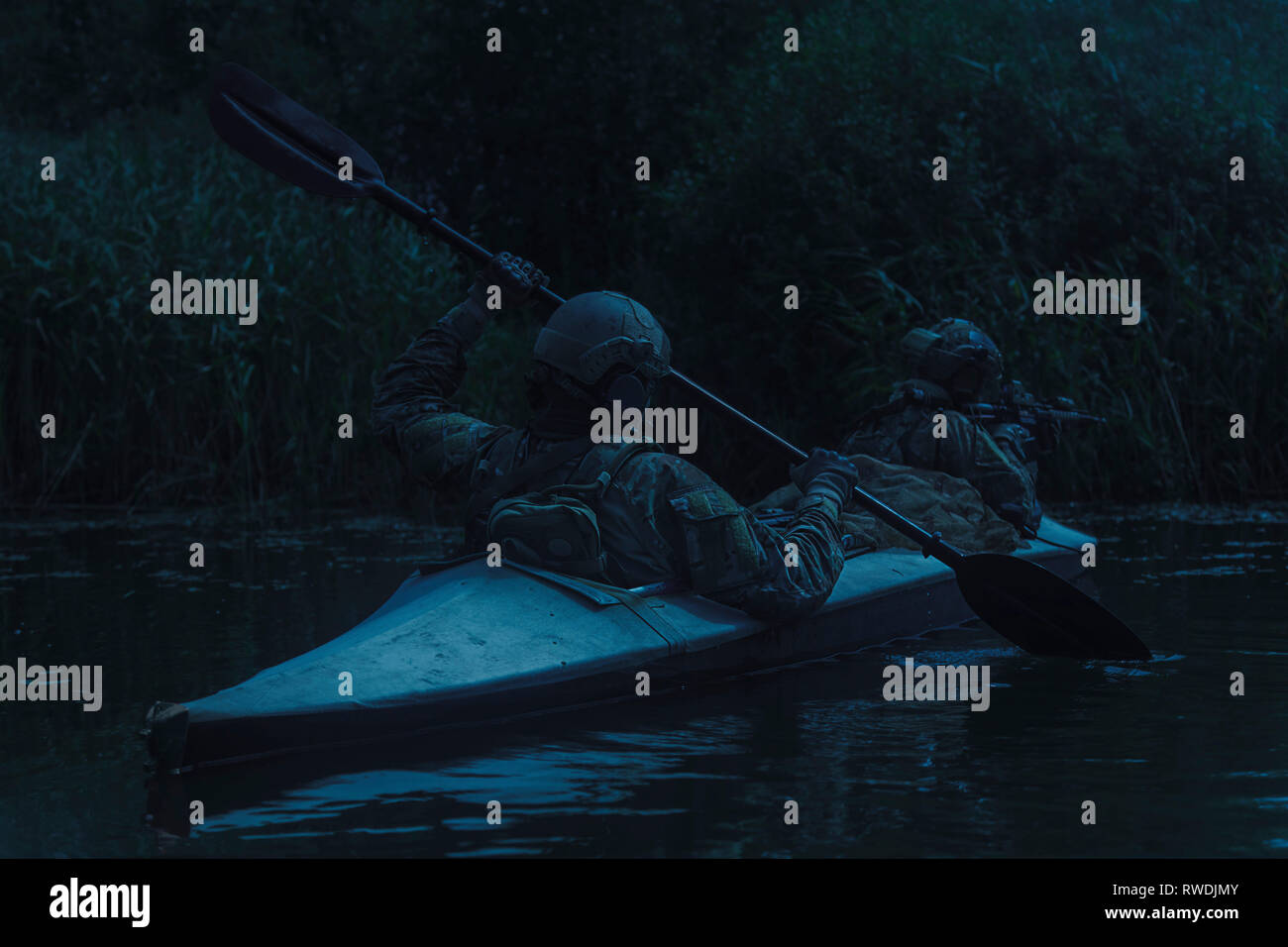 Special forces operators in a military kayak Stock Photo - Alamy
