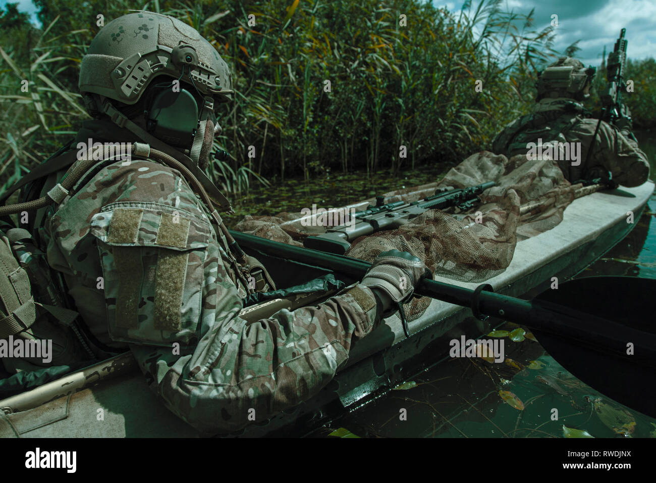 Special forces operators in a military kayak Stock Photo - Alamy