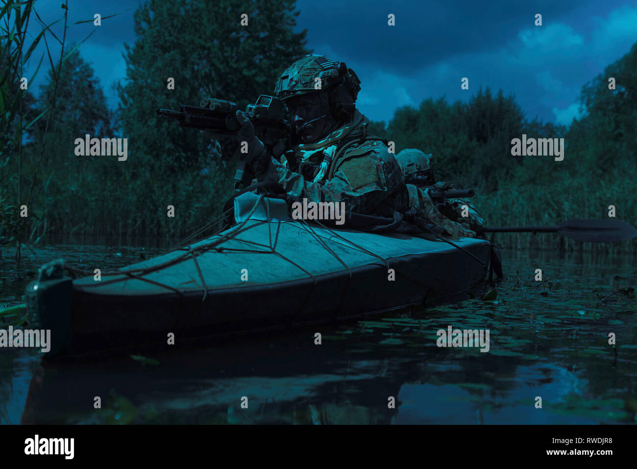 Special forces operators in a military kayak Stock Photo - Alamy