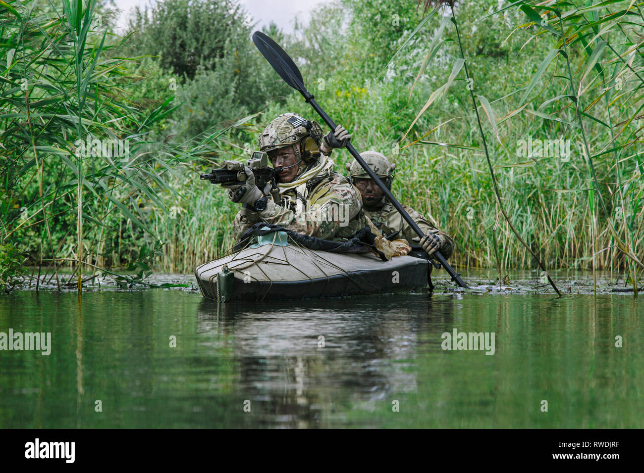 Special forces operators in a military kayak Stock Photo - Alamy