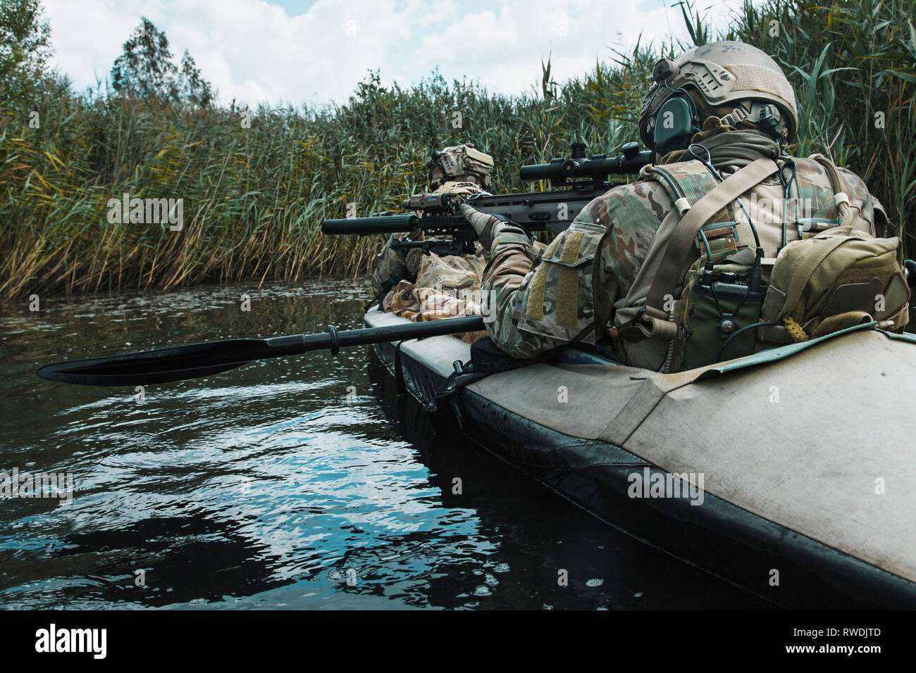 Special forces operators in a military kayak Stock Photo - Alamy