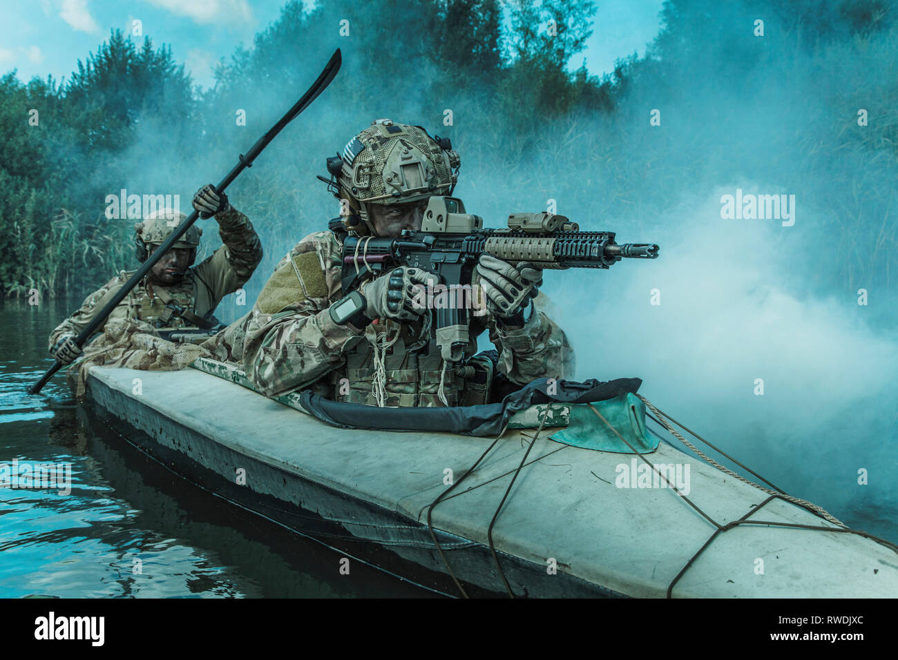 Special forces operators in a military kayak Stock Photo - Alamy