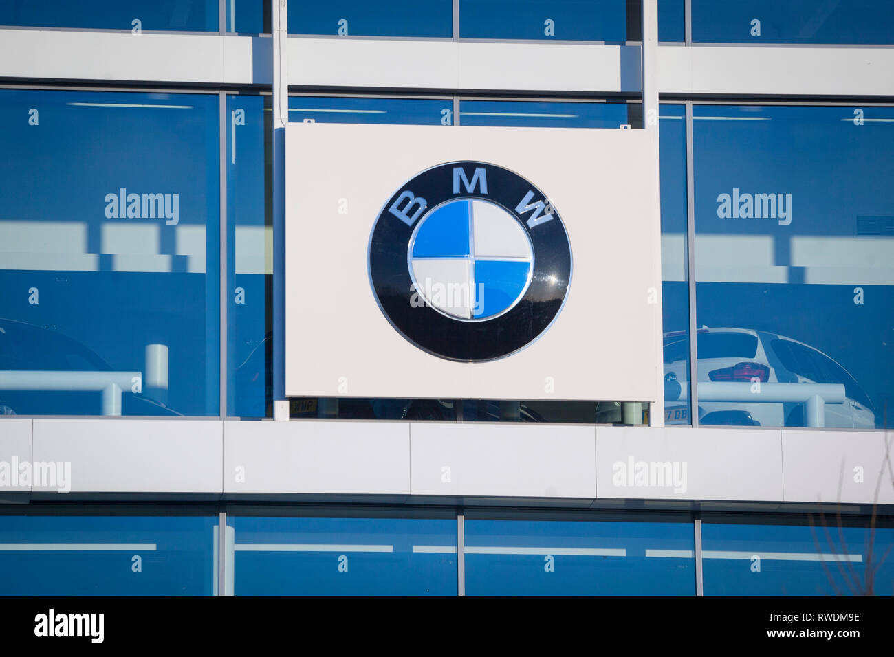 The BMW roundel and logo on the building of Cooper BMW in Reading ...