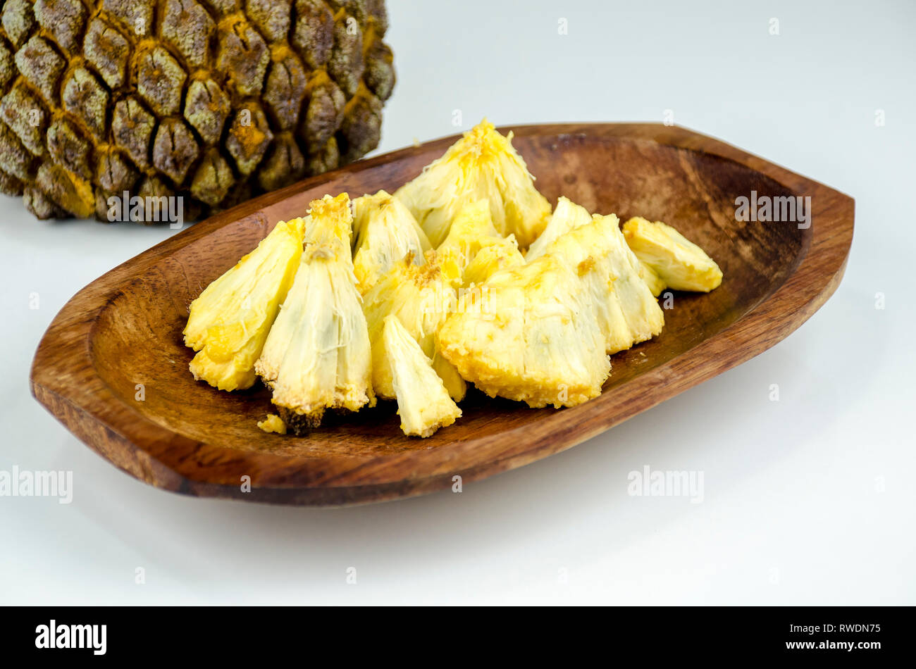 Edible part of marolo, araticum or bruto fruit on wooden bowl ...