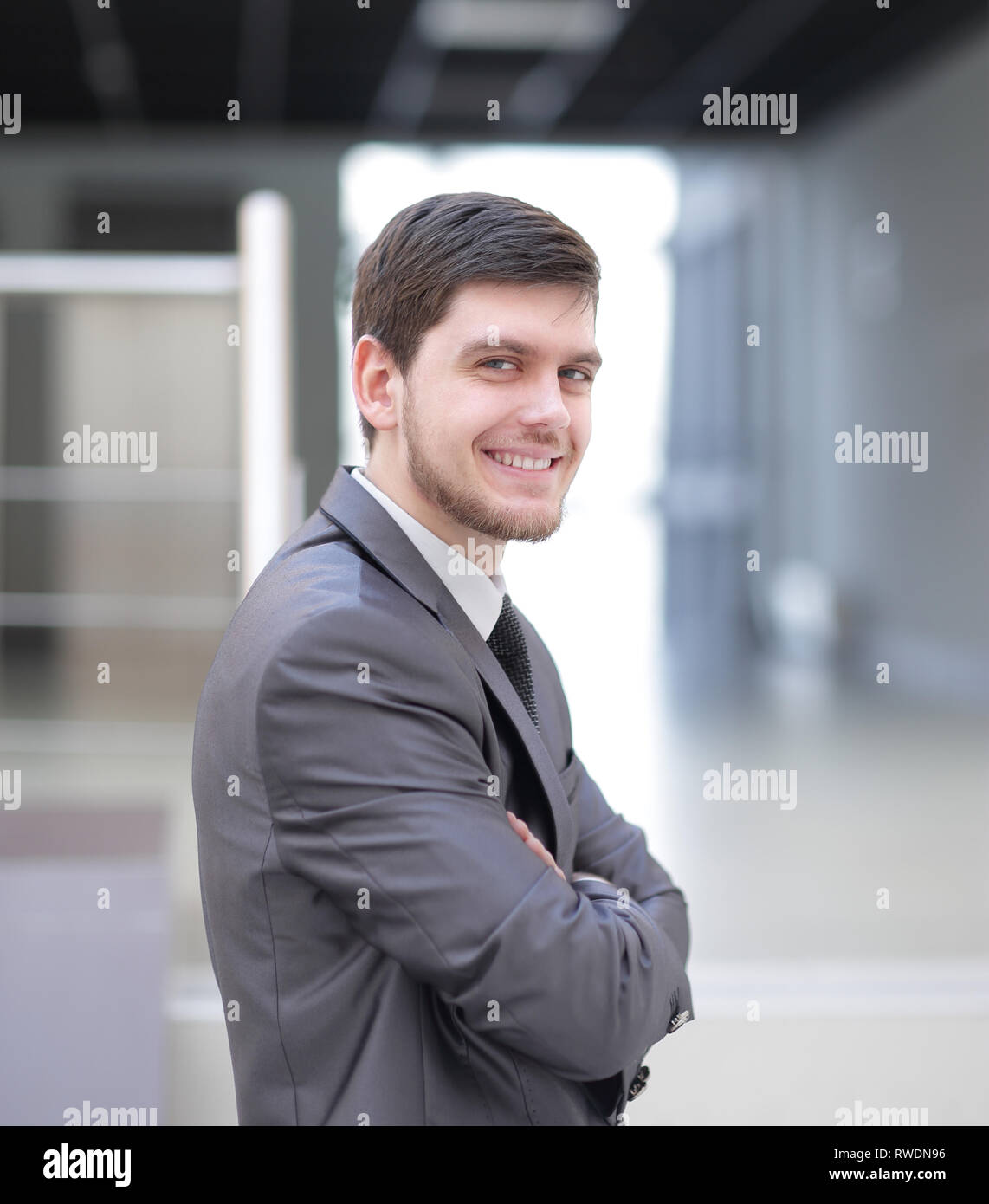 modern successful businessman on background of office Stock Photo - Alamy